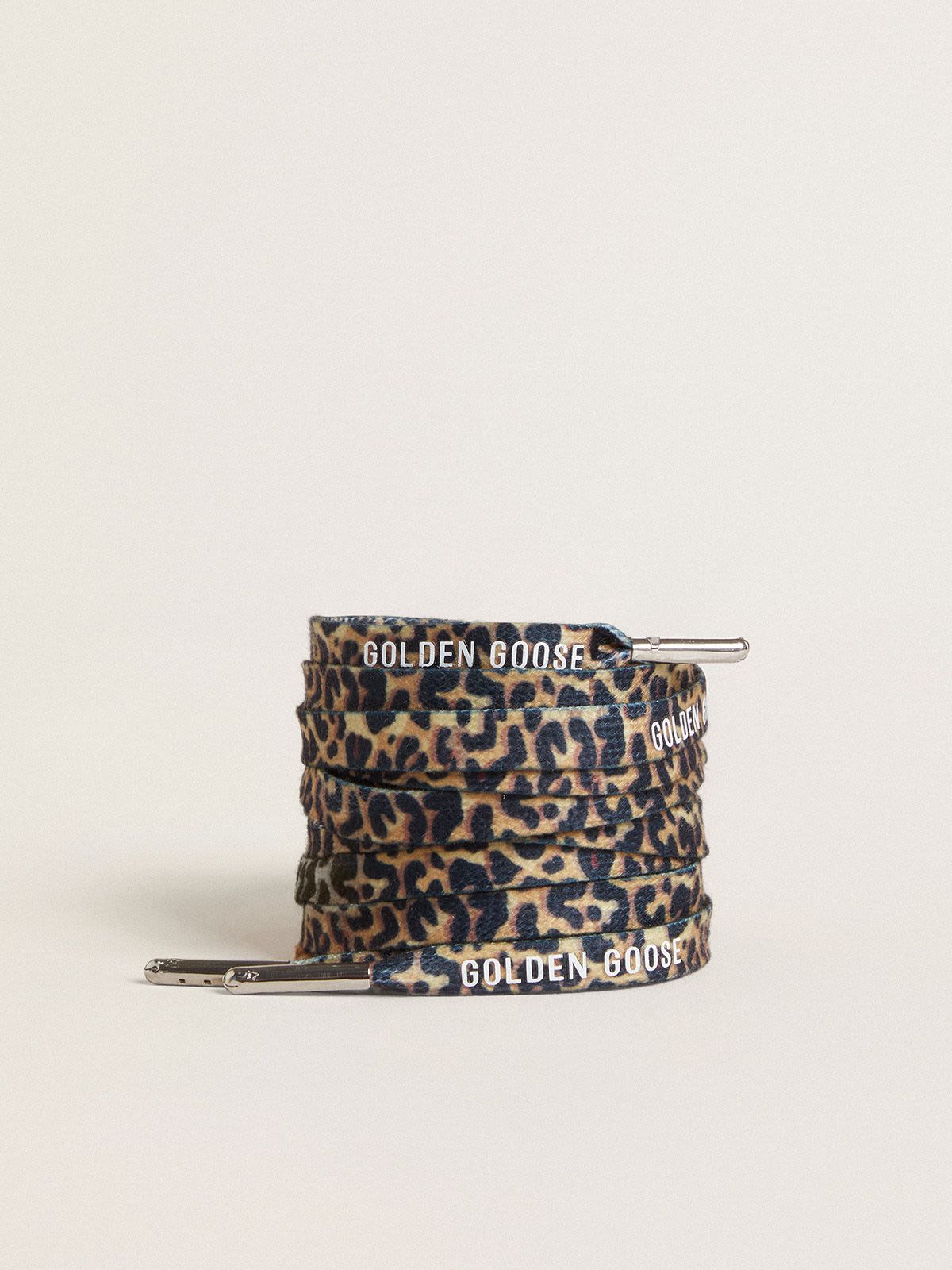 Beige and brown leopard-print laces with contrasting white logo ...