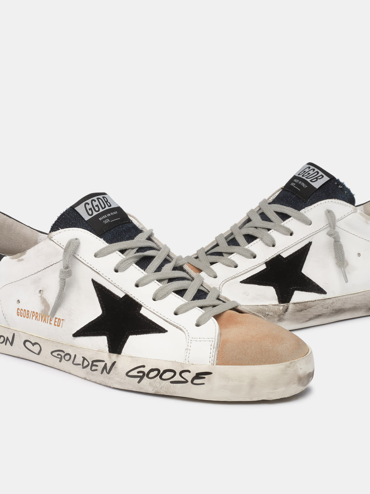 White and beige Super-Star sneakers with handwritten wording | Golden Goose