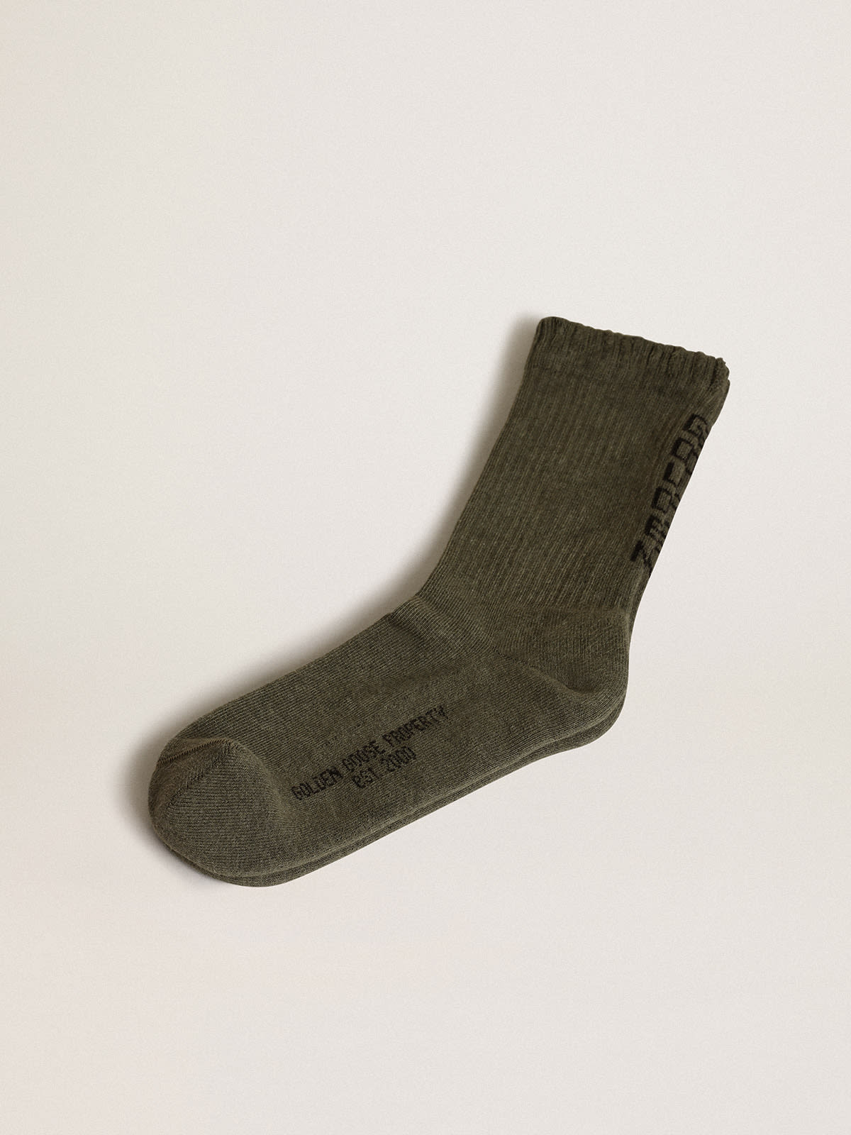 Olive-green cotton socks with distressed finish and black ‘Golden ...