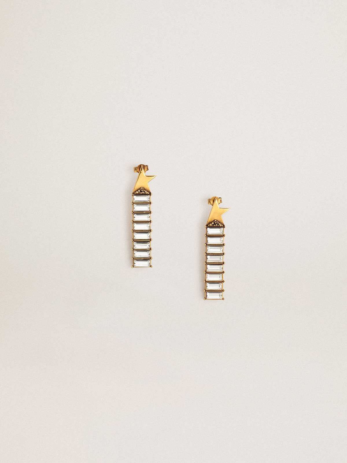Drop earrings with old gold star and baguette-shaped crystals | Golden ...